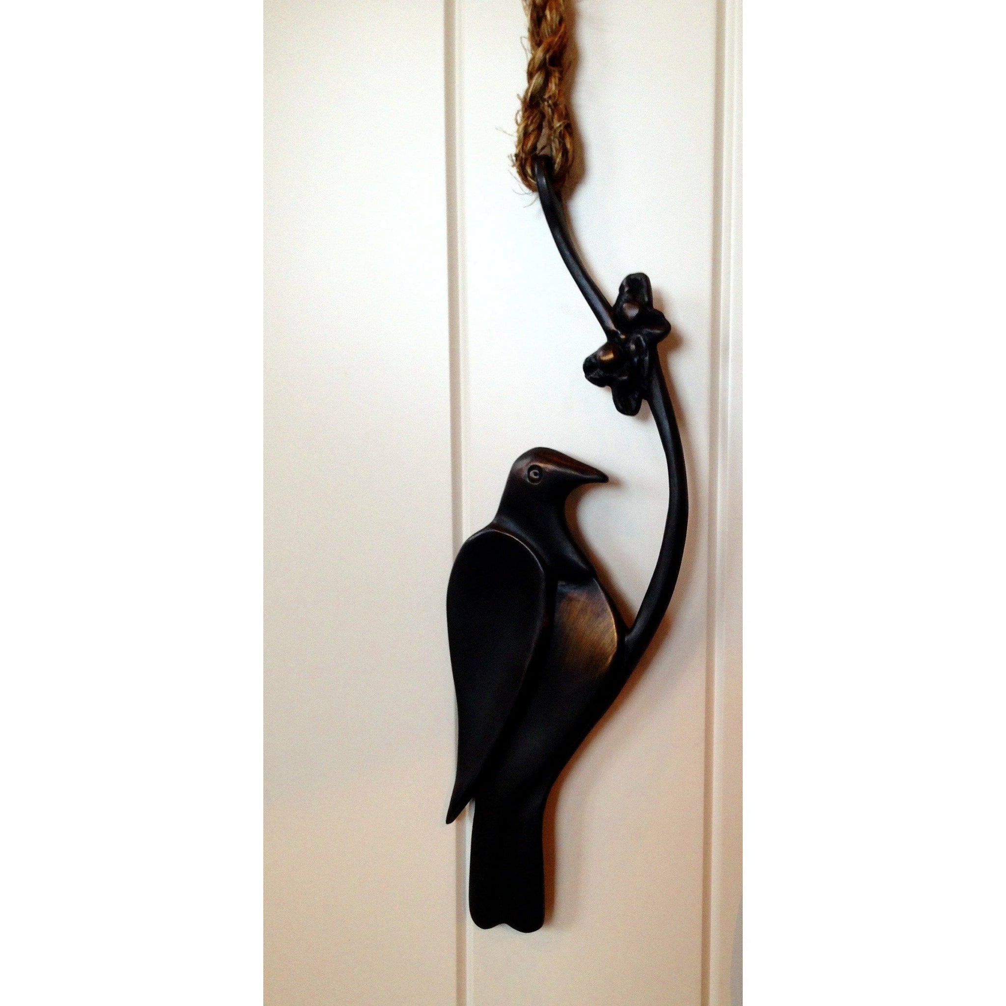 Bronze Kereru hanging on handwoven rope by Jay Lloyd Waiheke Island